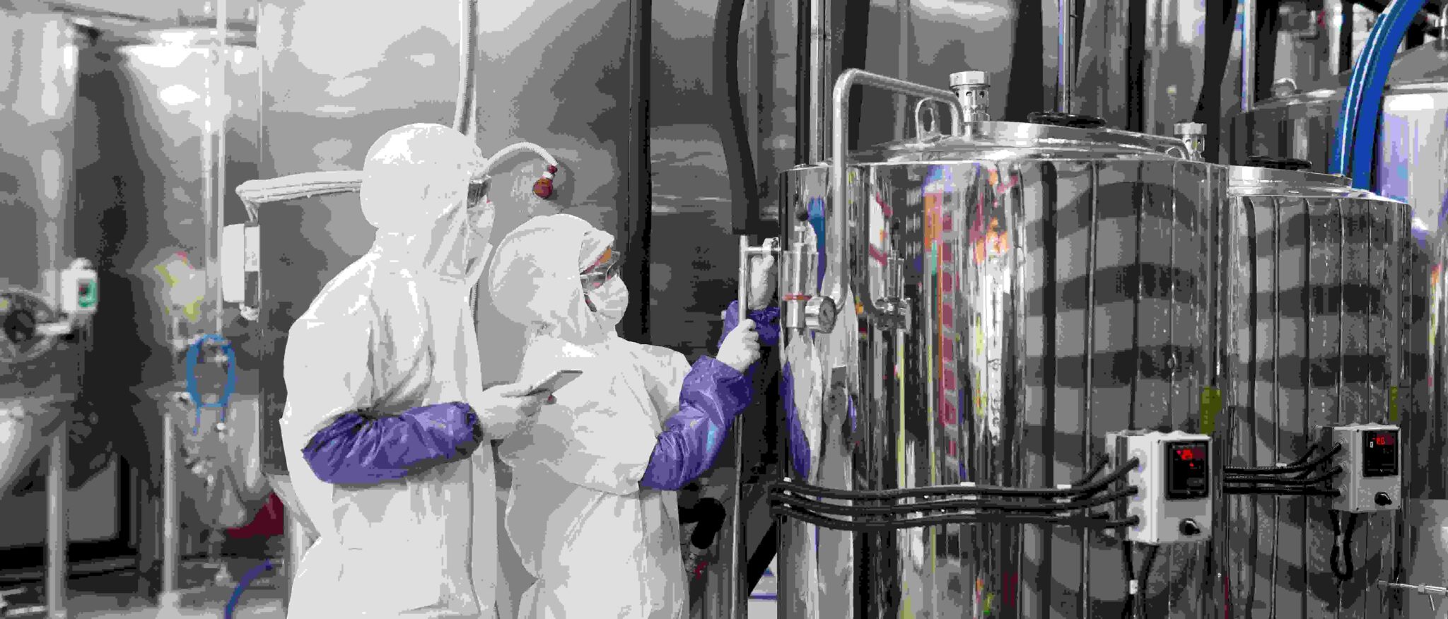 Two Workers Wearing Hazmat Suits at Chemical Factory | BIS Safety ...